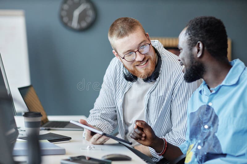 Collaborating in Modern Office with Digital Devices Stock Photo - Image ...