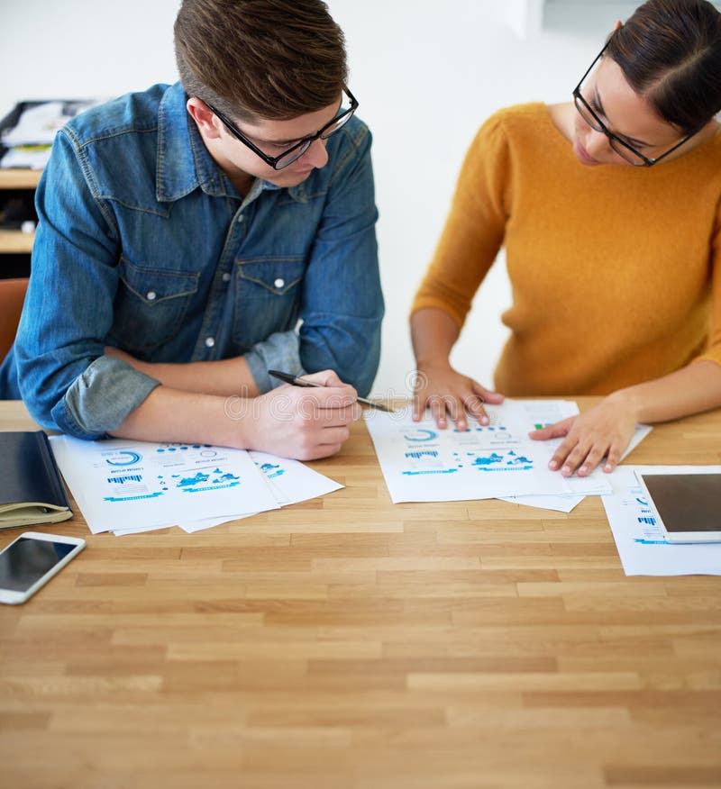 Collaborating on a New Design. Shot of Two Colleagues Working Together ...