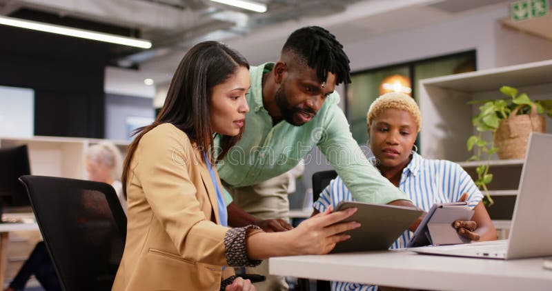 Collaborating in Office, Diverse Team Discussing Project Using Tablet ...
