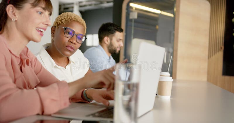 Collaborating on Project, Diverse Colleagues Discussing Work and Using Laptops in Office Stock ...