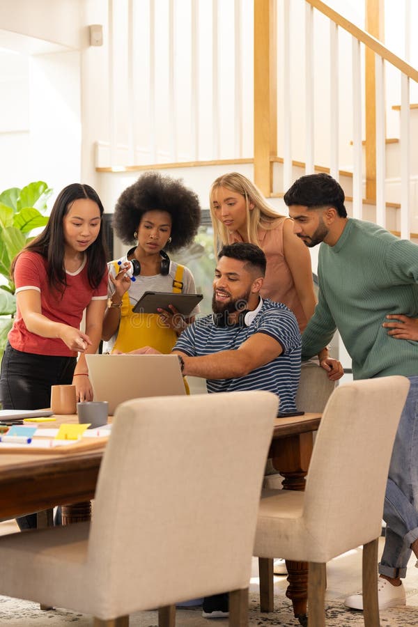 Collaborating on Project, Group of Young Friends Using Laptop and ...