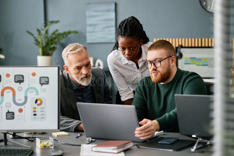 Collaborating on Project in Modern Office Setting Stock Image - Image ...