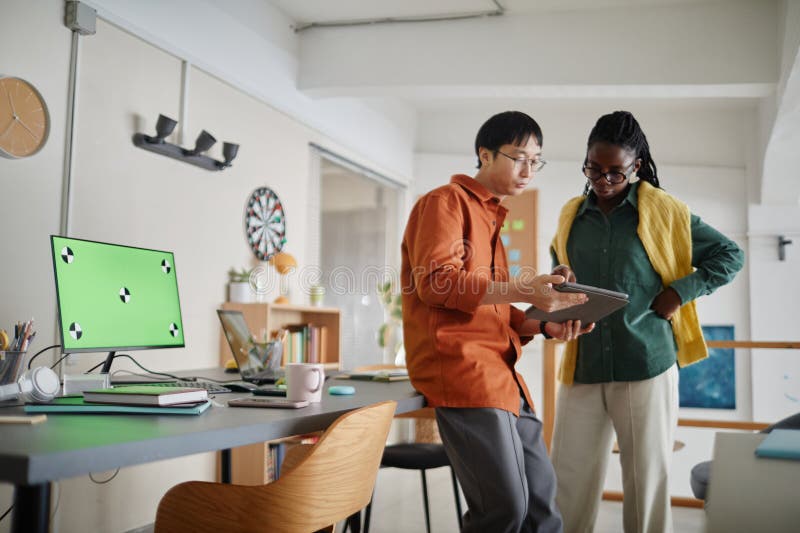 Collaborating on Project with Tablet in Modern Office Stock Image ...