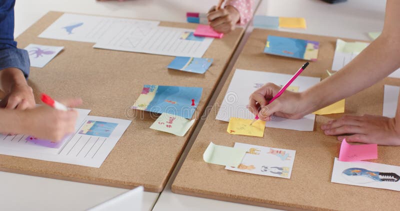 Collaborating in School, Students Brainstorming and Writing Ideas on ...