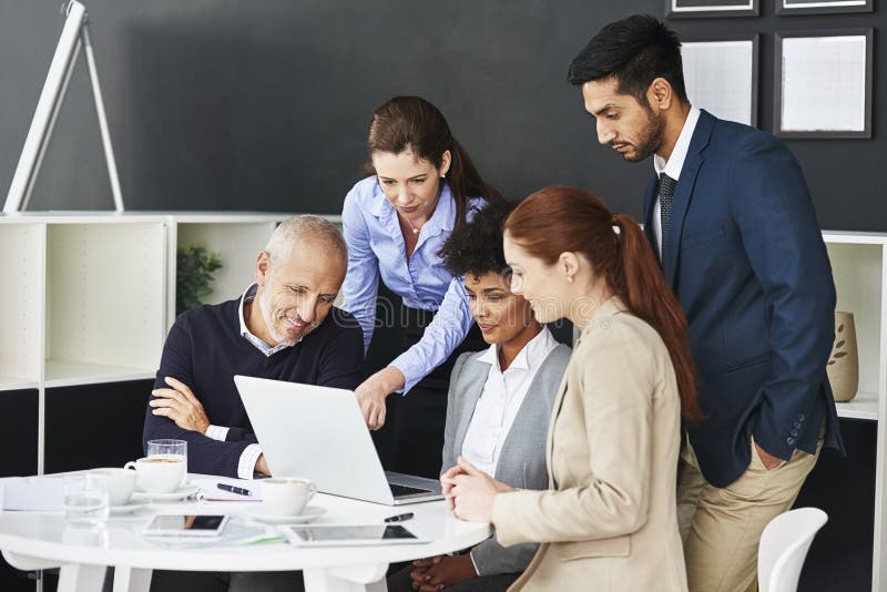 Collaborating for Success. a Group of Businesspeople Looking at ...