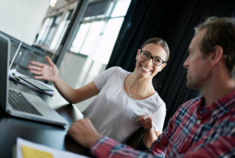 Collaborating on Success. Two Coworkers Working on a Laptop. Stock ...