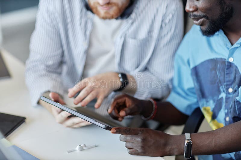 Collaborating on Tablet Project in Modern Office Setting Stock Photo ...