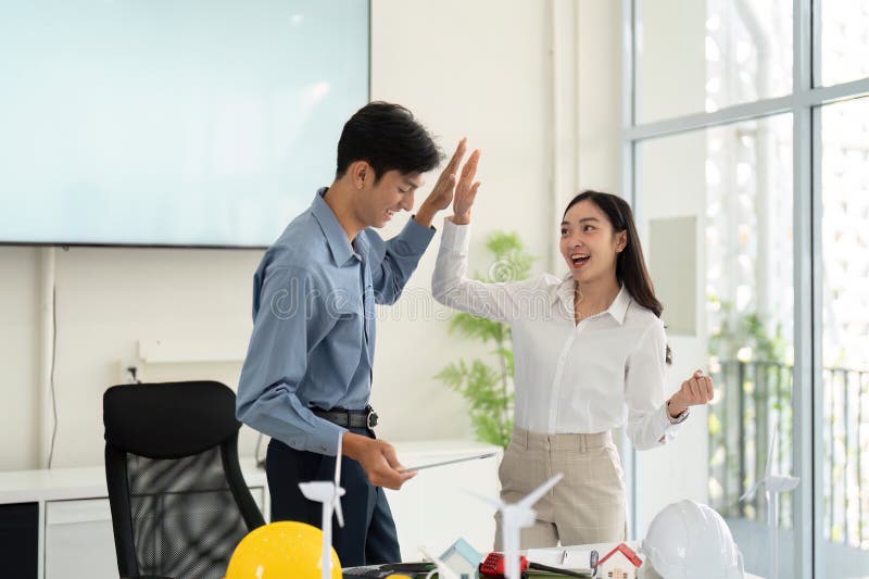 Collaboration and Achievement in Engineering. Engineers Celebrating a ...