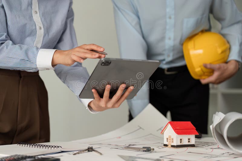 Collaboration and Construction Planning. Professionals Discussing ...