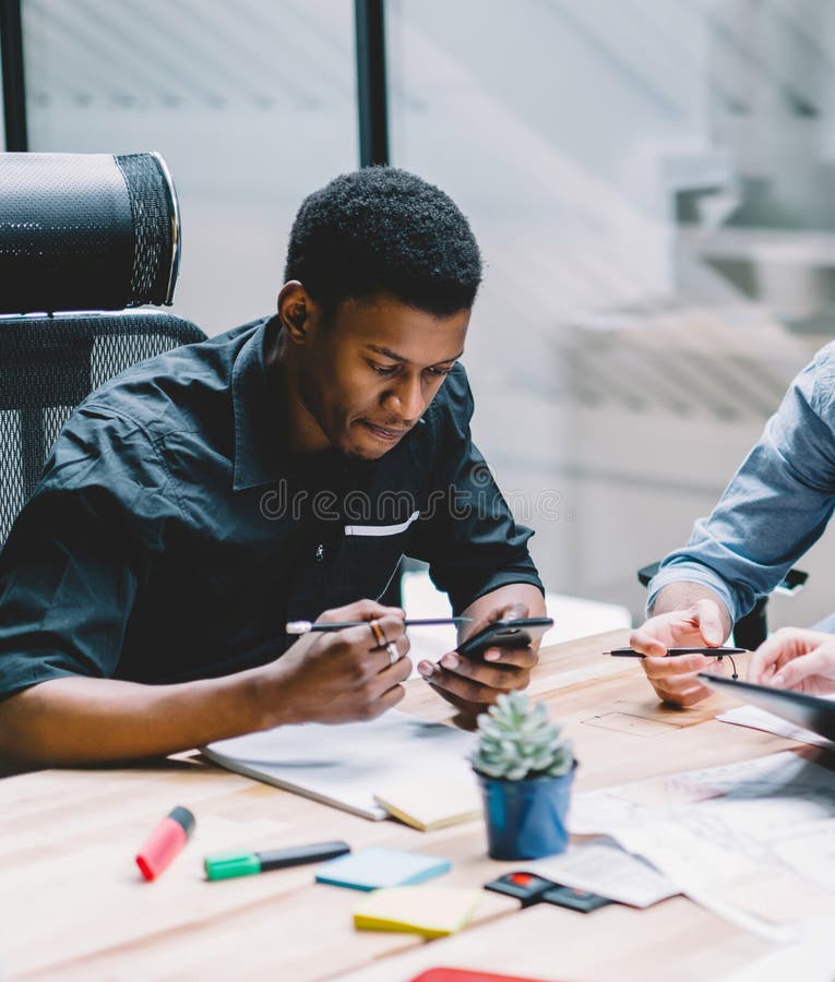 Collaboration and Cooperation.Four Colleagues Sharing Opinions at ...