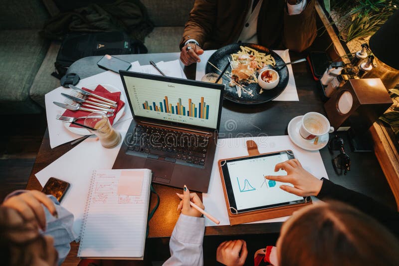 Collaboration and Data Analysis during a Business Strategy Meeting at a ...