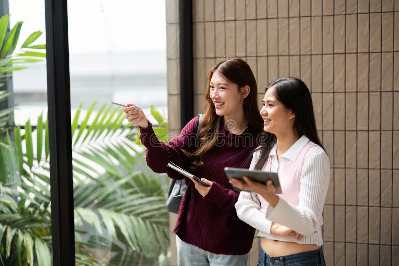 Collaboration and Friendship. Two Students Interacting in a Bright ...