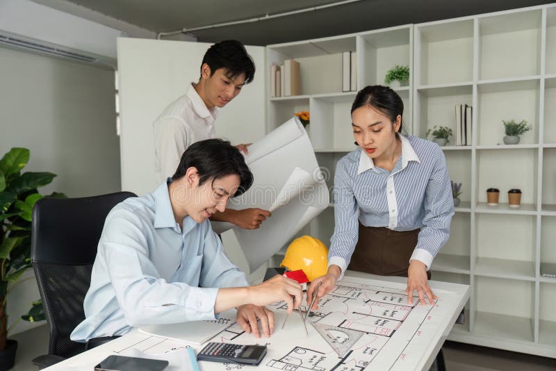 Collaboration and Planning. a Team of Architects Working Together on ...