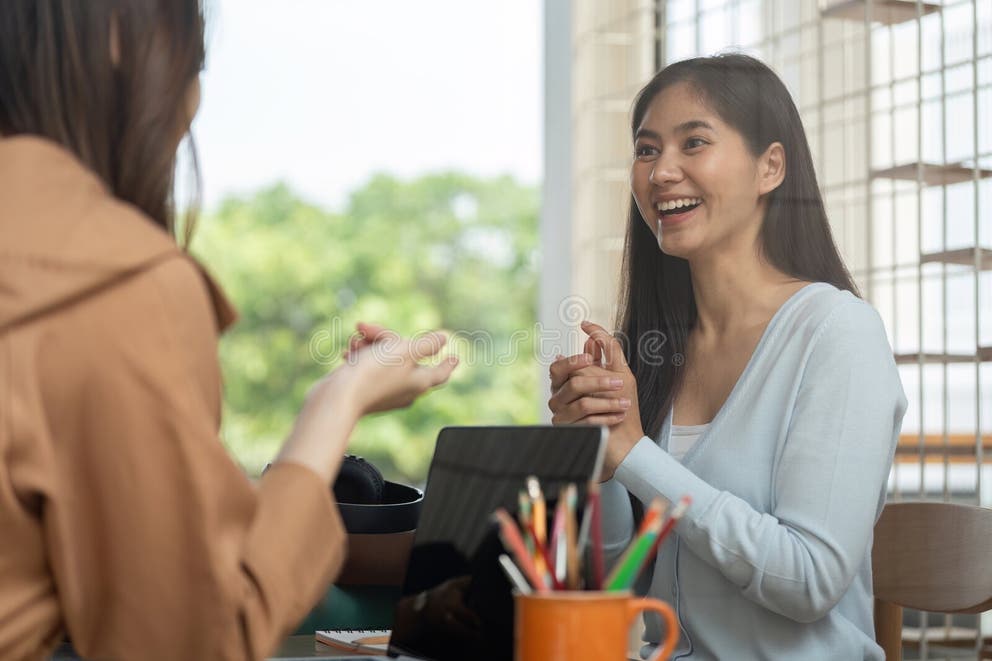 Collaboration and Study Session. Two Students Engaged in an Animated ...