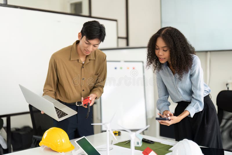 Collaboration and Sustainable Design. Two Professionals Discussing ...
