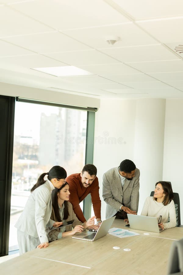 Collaboration Thrives in a Modern Office with Stylish Professionals ...