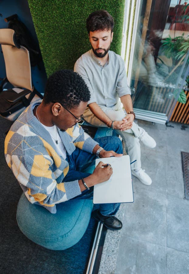 Multiracial Team of Business People Collaborating in a Modern Office ... Multiracial Team of Business People Collaborating in a Modern Office ...