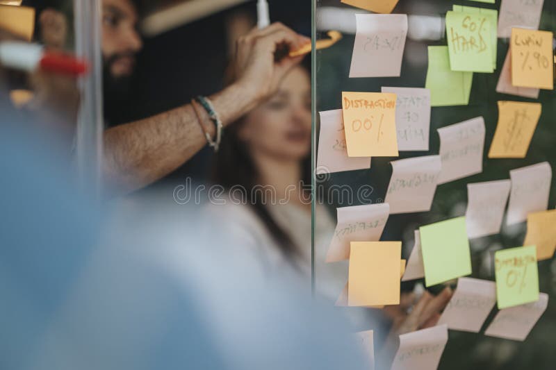 Collaborative Business Group Brainstorming Ideas on Glass Wall with ...