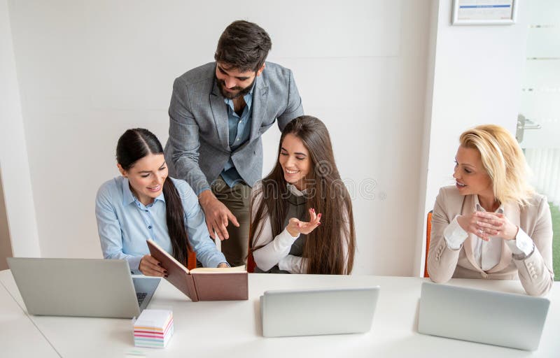 Collaborative Colleagues Working Together on a Common Office Project ...