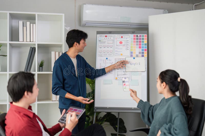 Collaborative Design Session. a Team Discusses a UI Project while ...