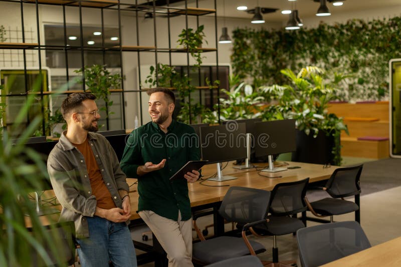 Collaborative Discussion in a Modern Office with Exposed Brick Walls ...