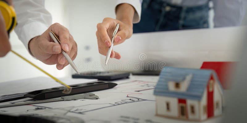 Collaboration and Construction Planning. Colleagues Discussing ...