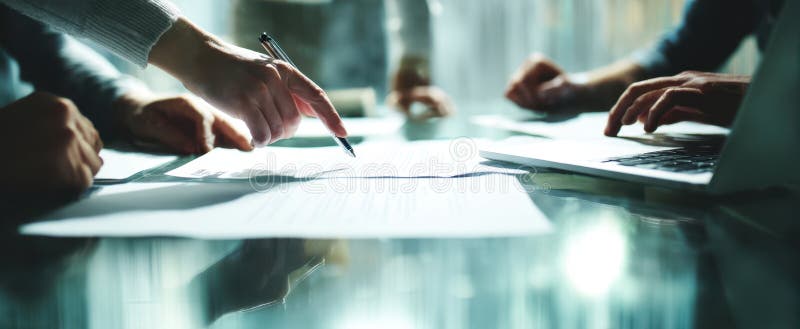 The Collaborative Effort of a Team Discussing Important Documents at a ...