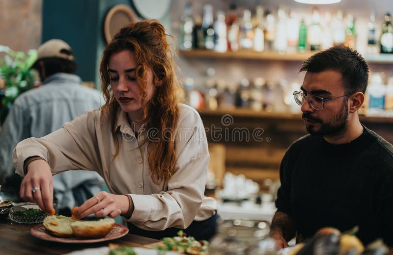 Collaborative Food Preparation in a Cozy Lounge Bar Setting Stock Image ...