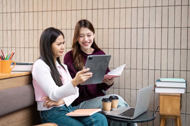 Collaborative Learning and Coffee Break. Friends Studying and ...