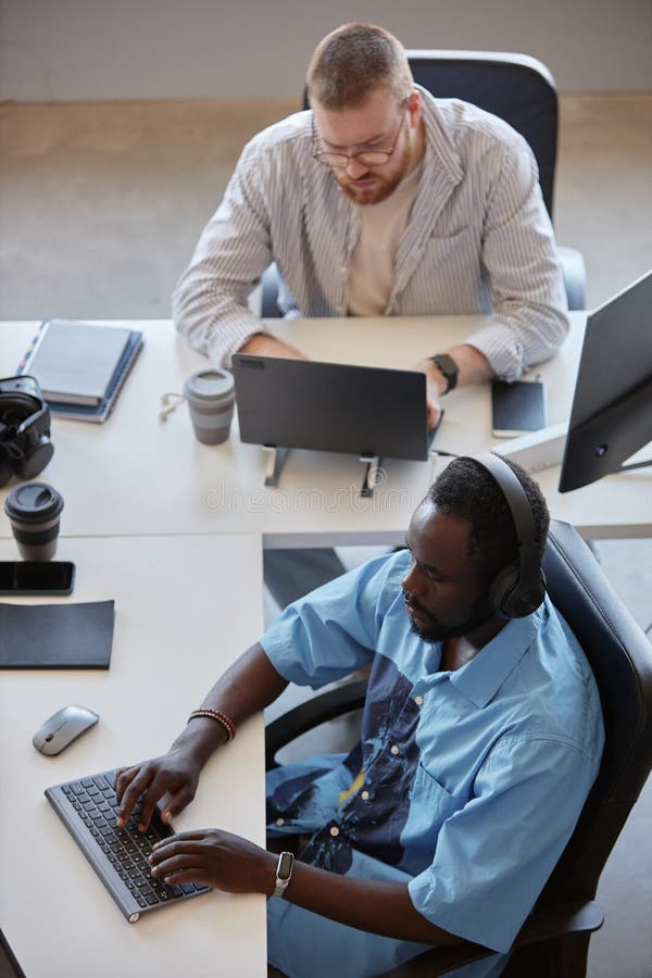 Collaborative Office Colleagues Sitting at Desk Working Stock Image ...