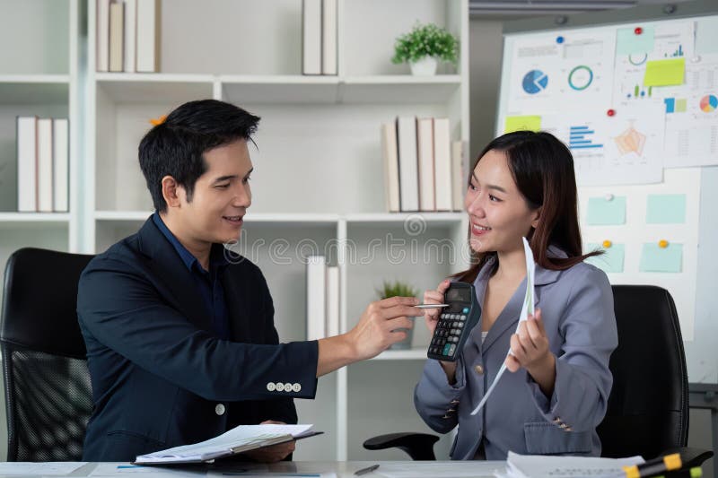 Interaction and Decision Making. Team Members Reviewing Financial Data ...