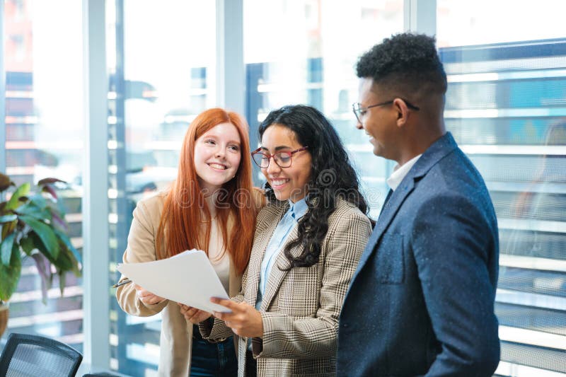 Collaborative Project in Bright Co-working Space Led by Young Latin Businesspeople. Teamwork and ...