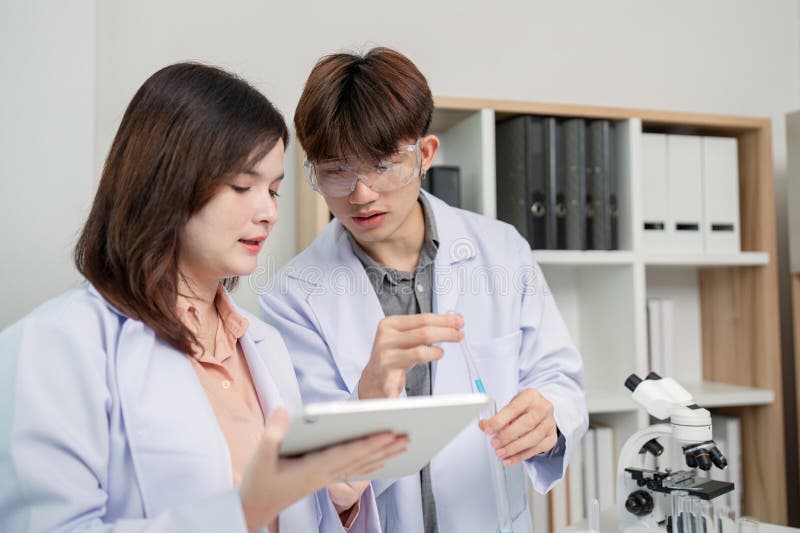 Collaborative Scientists Discussing Experiment Data for Research ...