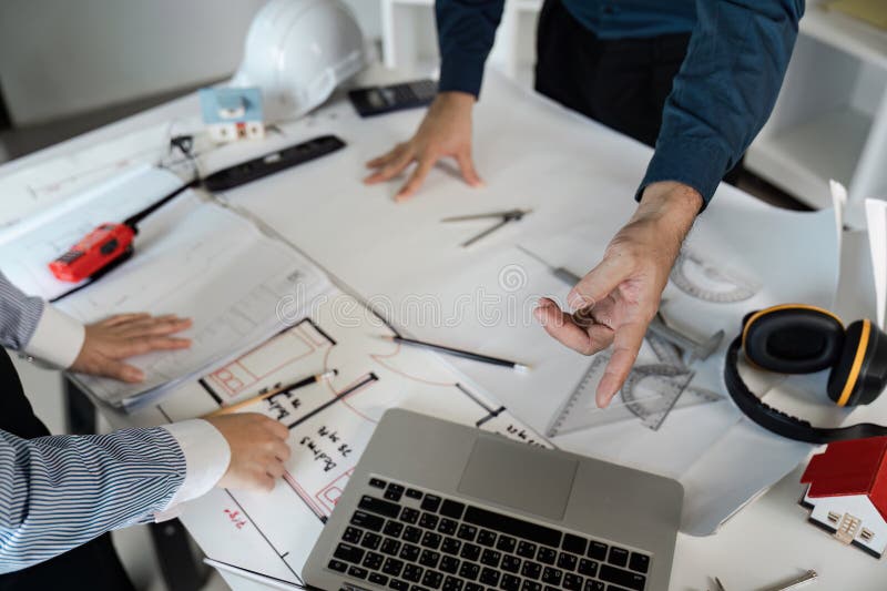 Engineers and Architects Collaborate on Blueprint Designs in Modern ...