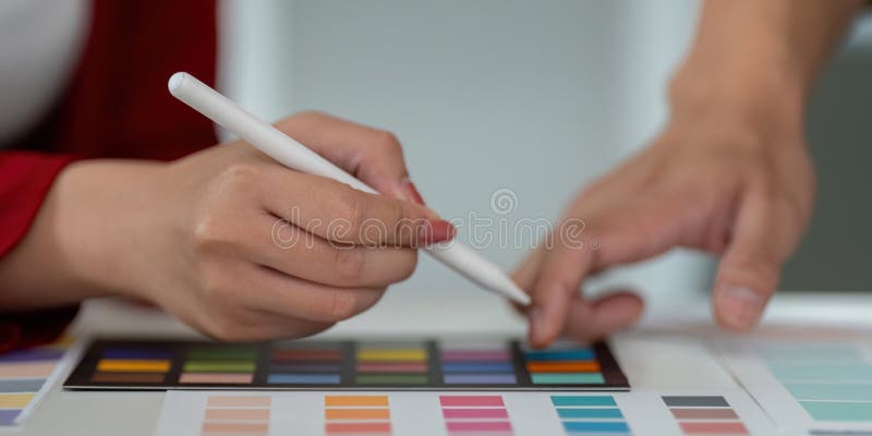 Creative Process and Hands-on Collaboration. Team Members Use Tablets ...