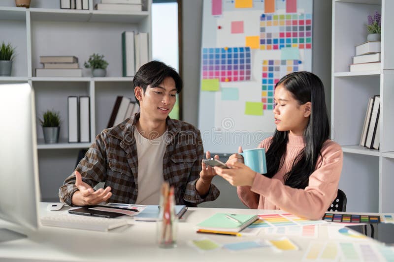 Design Team Meeting on Color Chart Graphics in a Creative Workspace ...