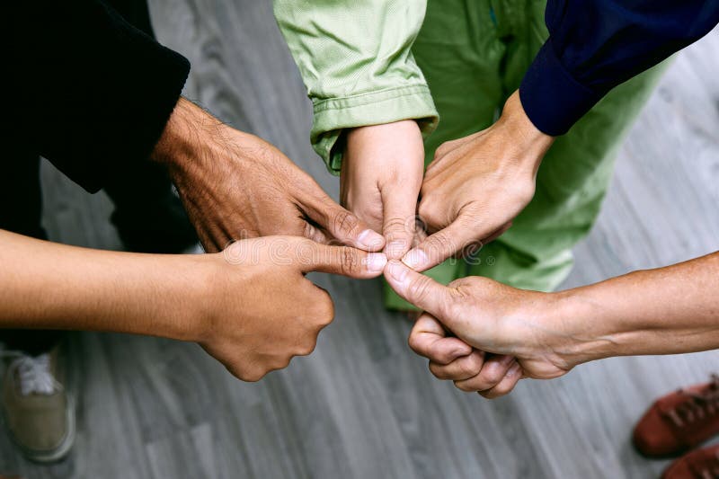 A Collaborative Standing Team Giving Thumbs Up with Circle Shape Close ...