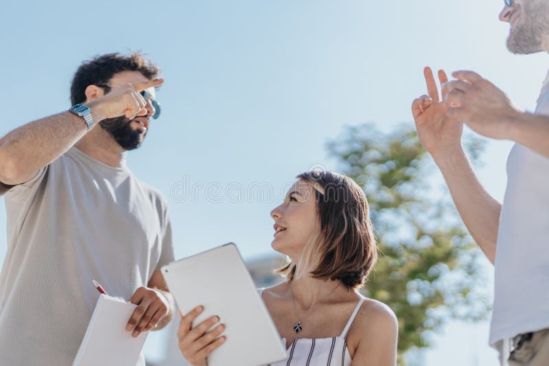 Collaborative Team of Architects and Construction Engineers Discussing ...