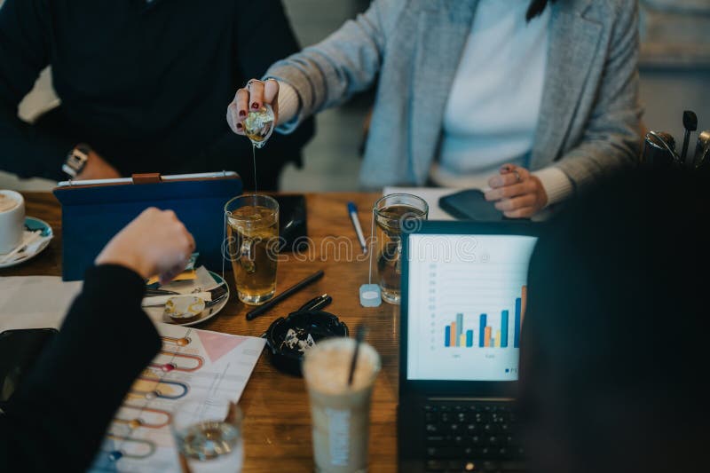 Collaborative Team Discussing Strategies with Technology and ...