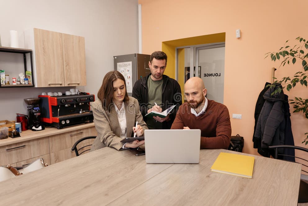 Collaborative Team Working Together in Modern Office Kitchen with ...