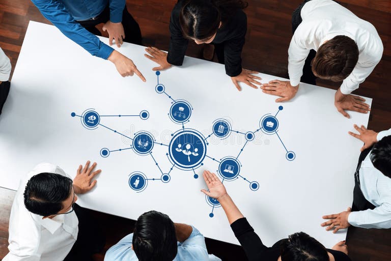 Collaborative Teamwork Over a Table with Network Graphics Illustrating ...