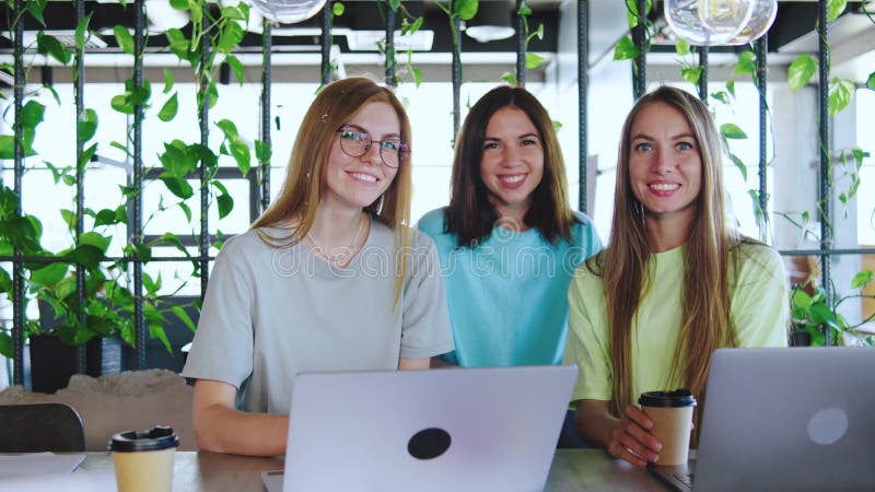 In a Collaborative Work Environment, Three Friends Gather To Engage in ...