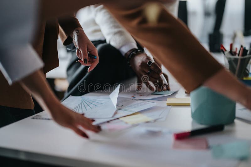 Business Professionals Collaborating Over Documents in Modern Office ...