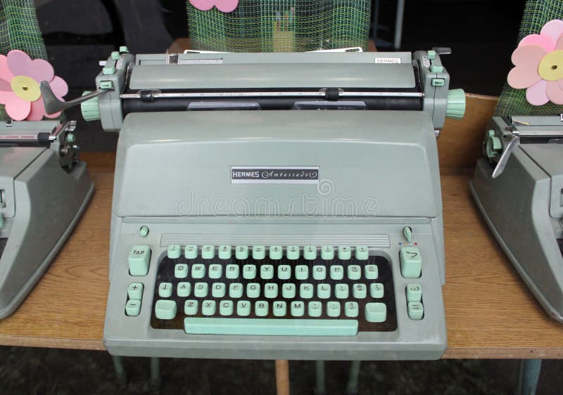 Three Antique Typewriters are Set on a Table with Flowers Editorial ...