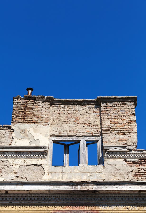 Collapsing Facade of an Old Urban Abandoned House with Cracks and ...