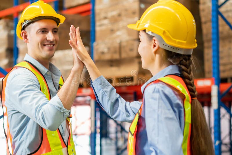 Colleague Workers in Warehouse Factory Have a Greeting by High Five ...