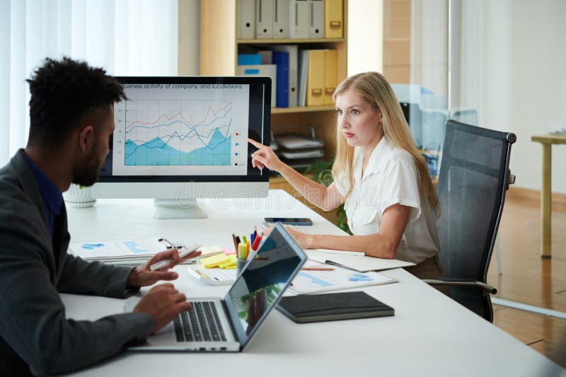 Colleagues Analyzing Company Activity Report Stock Photo - Image of ...