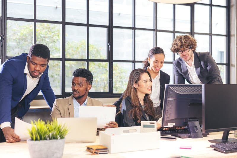 Colleagues in a Boardroom Discussion, Seated at a Table Together ...