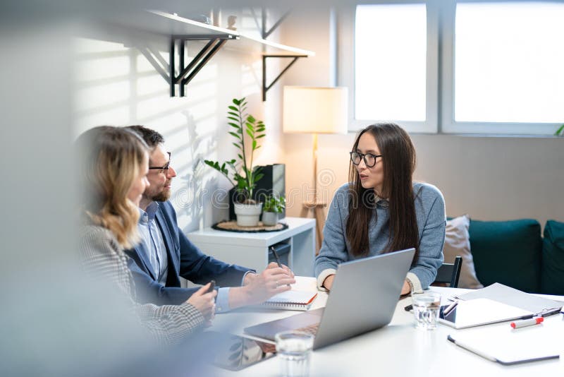 Colleagues and Clients Talking Strategy with Laptop and Tablet. in ...
