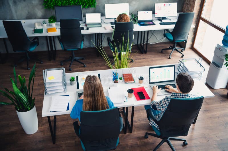 Colleagues Collaborating at a Bright Modern Coworking Space Featuring ...